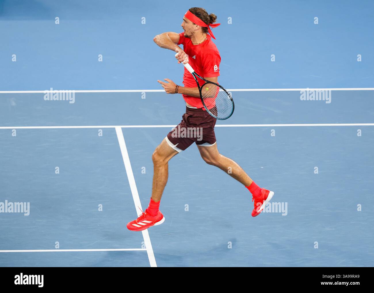 German tennis player Alexander Zverev playing forehand shot at Australian Open 2025 tournament ...