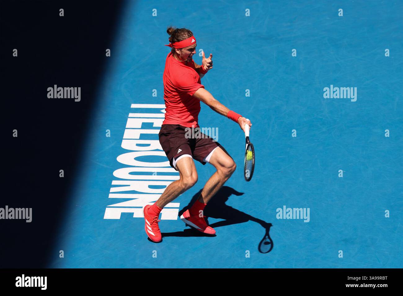 German tennis player Alexander Zverev playing forehand shot at Australian Open 2025 tournament ...