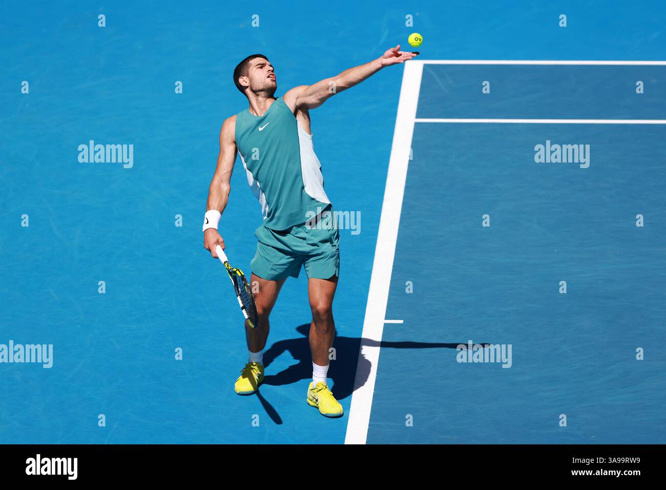 Spanish tennis player Carlos Alcaraz (ESP) playing a service shot at ...