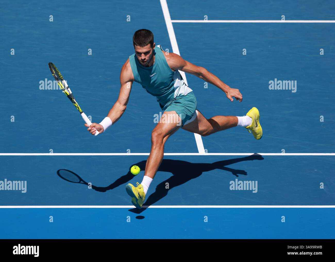 Spanish tennis player Carlos Alcaraz (ESP) playing forehand shot at Australian Open 2025 ...