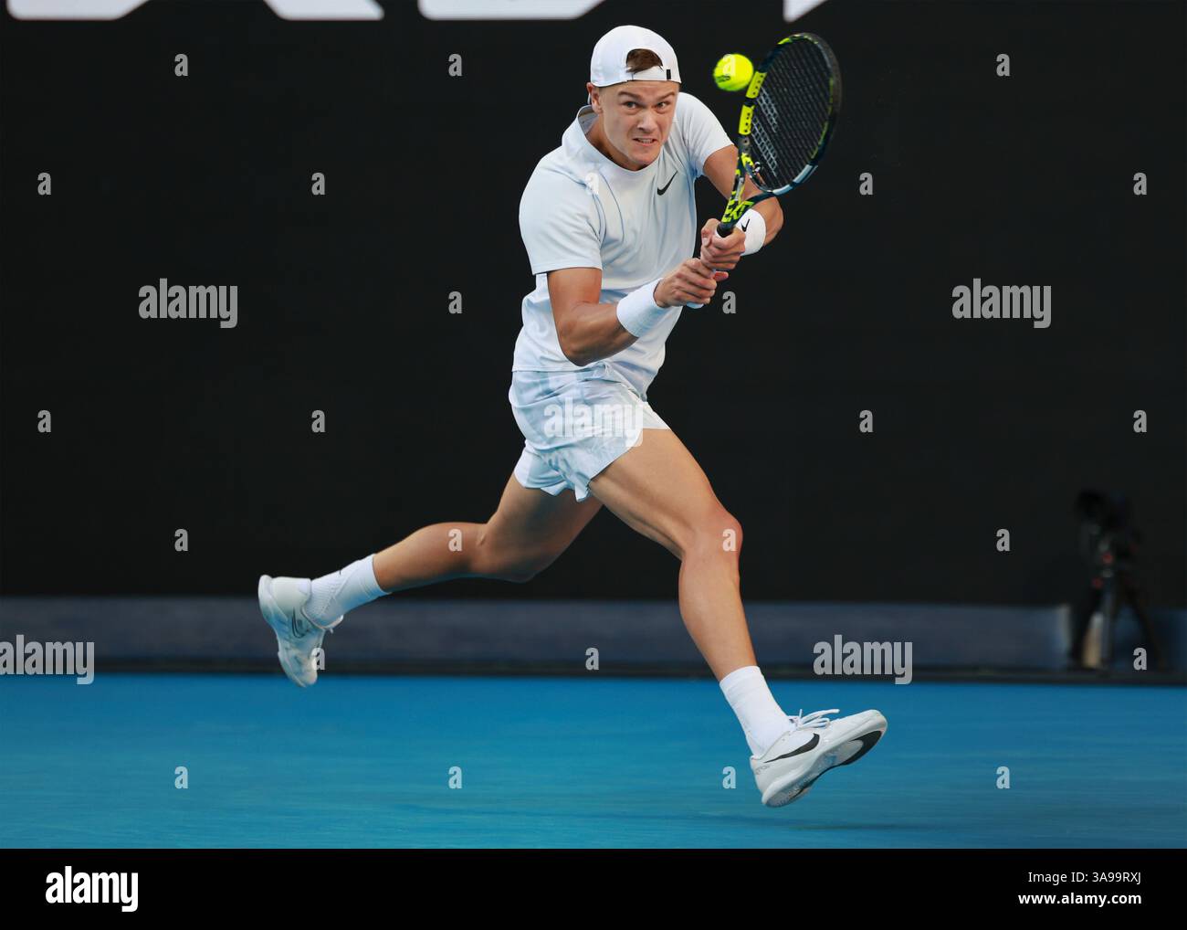 Danish tennis player Holger Rune playing a backhand shot at the ...