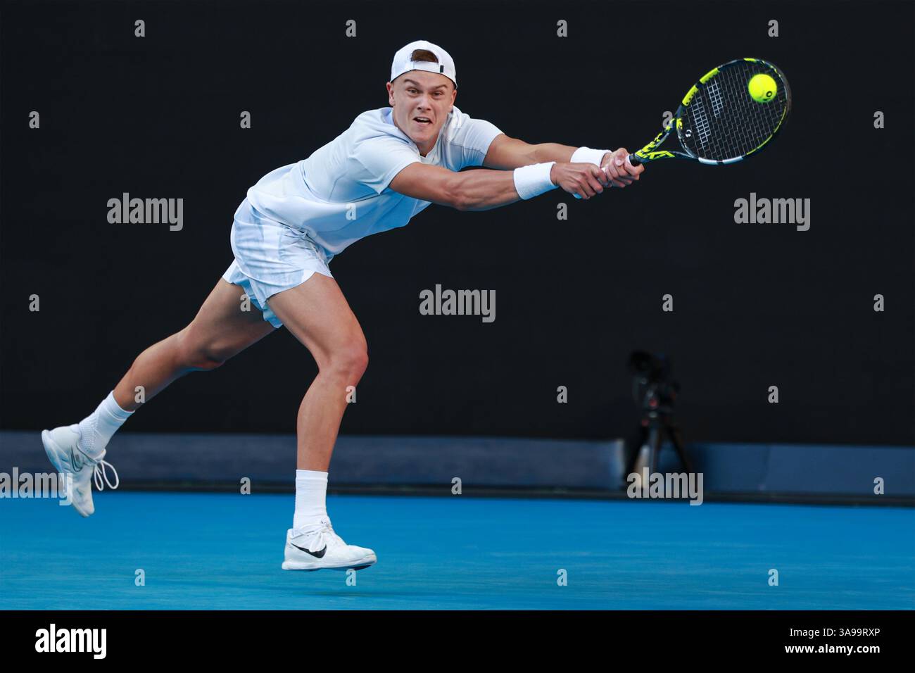 Danish tennis player Holger Rune playing a backhand shot at the ...