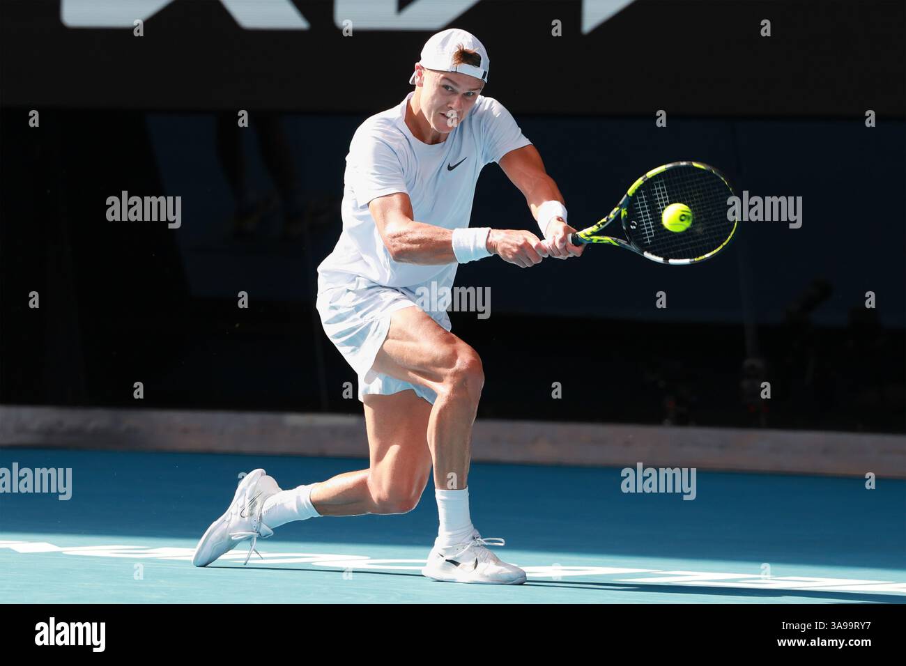 Danish tennis player Holger Rune playing a backhand shot at the ...