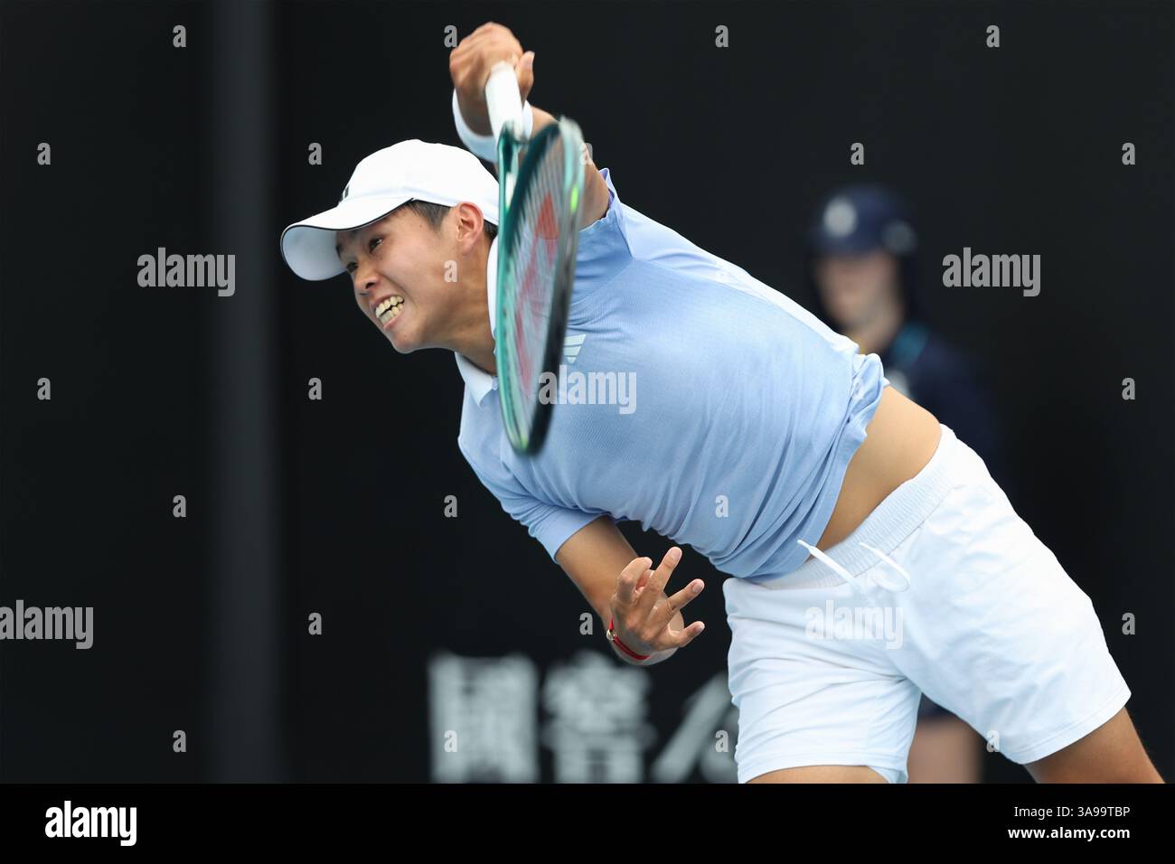 American tennis player Learner Tien (USA) playing a service shot at the ...