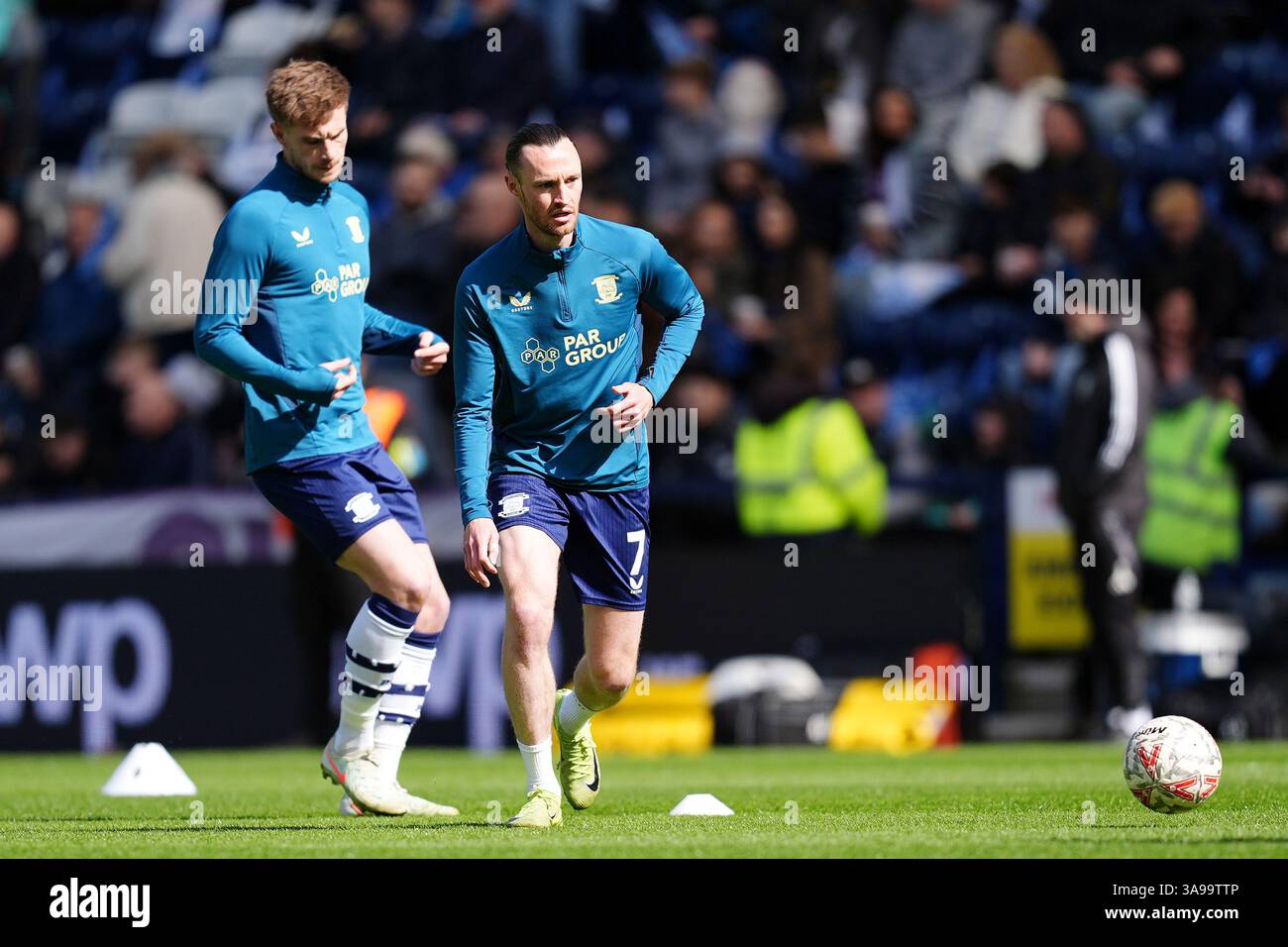 Preston North End's Will Keane (right) warms up ahead of the Emirates ...