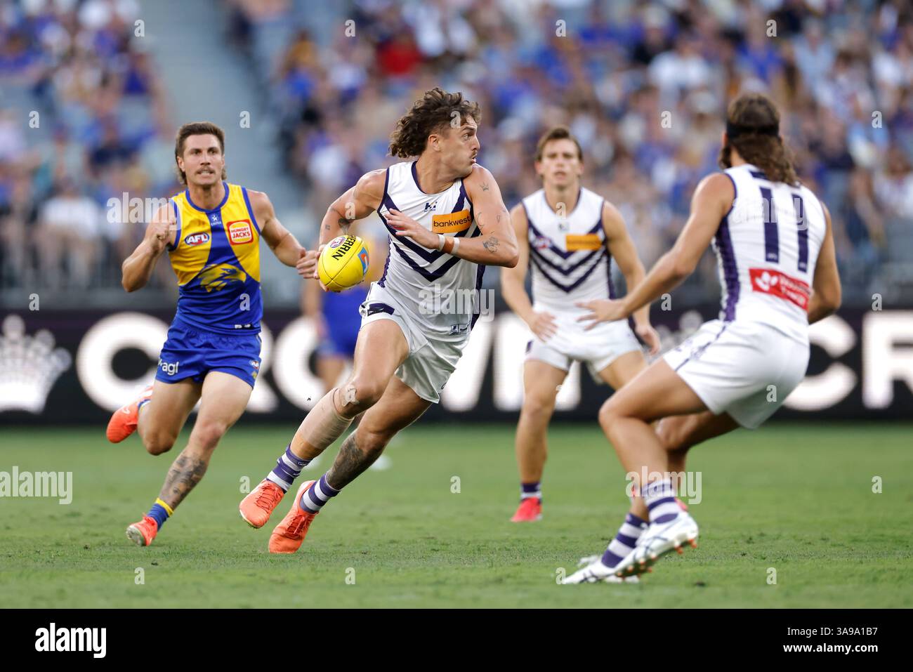 Perth, Australia. 30th Mar, 2025. Luke Jackson of the Dockers runs the ...
