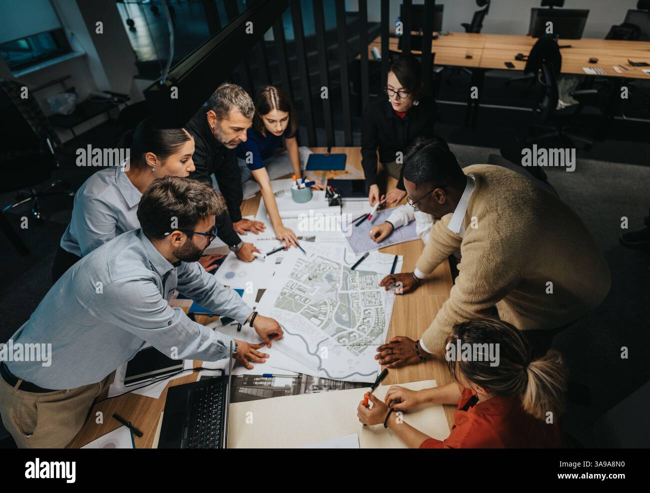 Multicultural team engaged in collaborative office meeting session ...