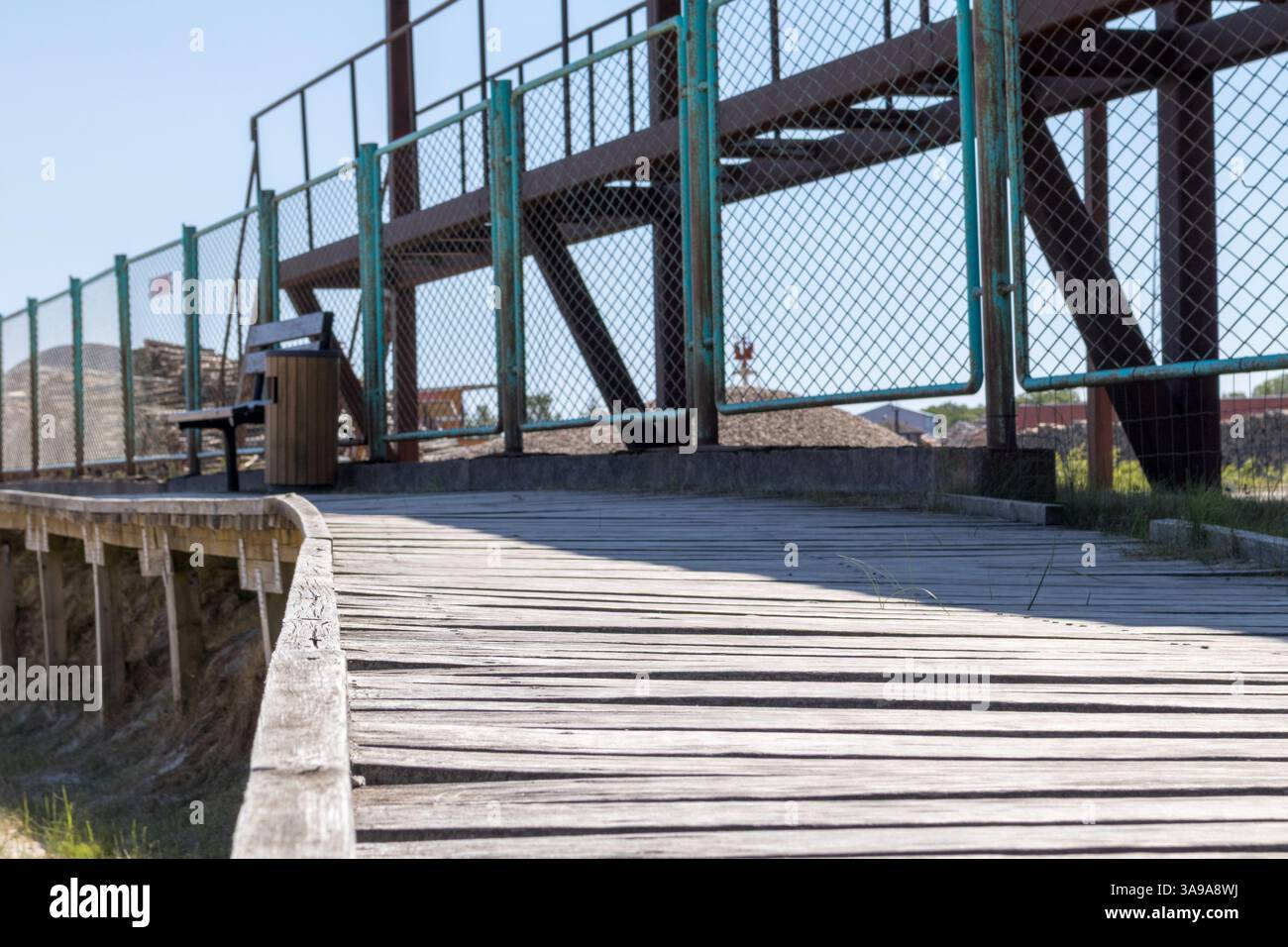 wooden boardwalk with metal fence Stock Photo - Alamy