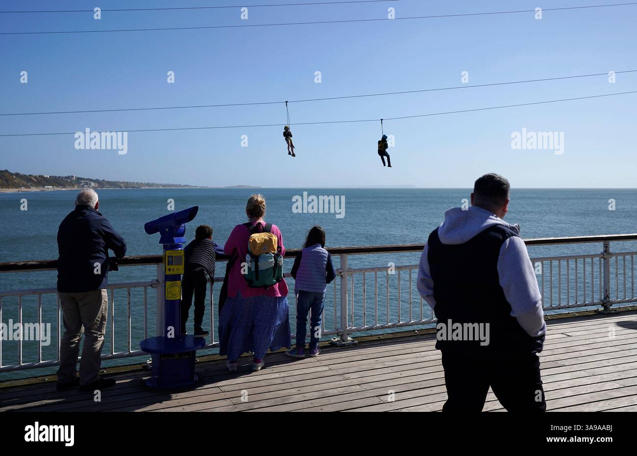 People zip line from Bournemouth pier towards Bournemouth Beach in ...