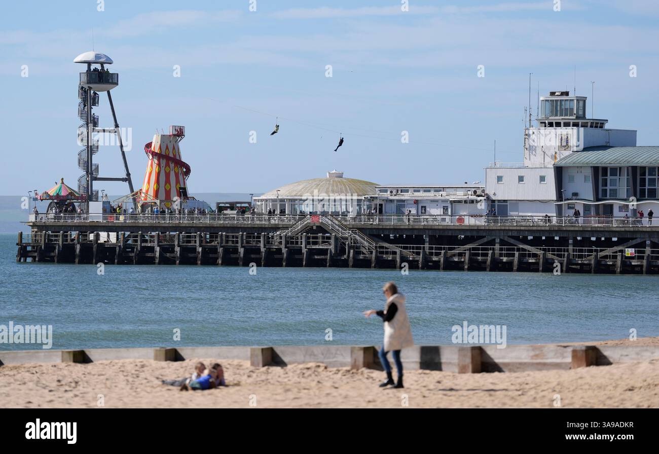People zip line from Bournemouth pier towards Bournemouth Beach in ...