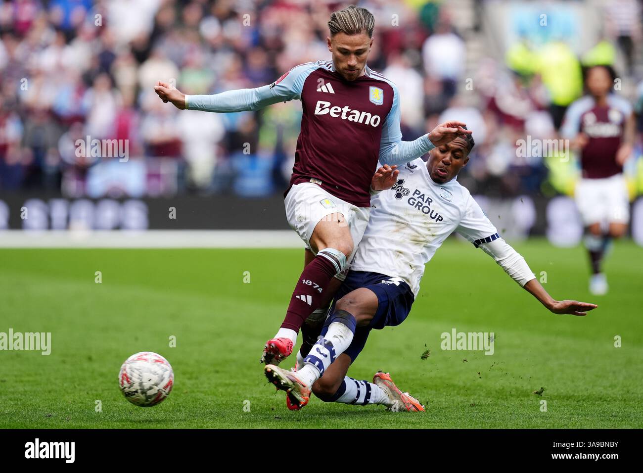 Aston Villa's Matty Cash (left) is tackled by Preston North End's ...