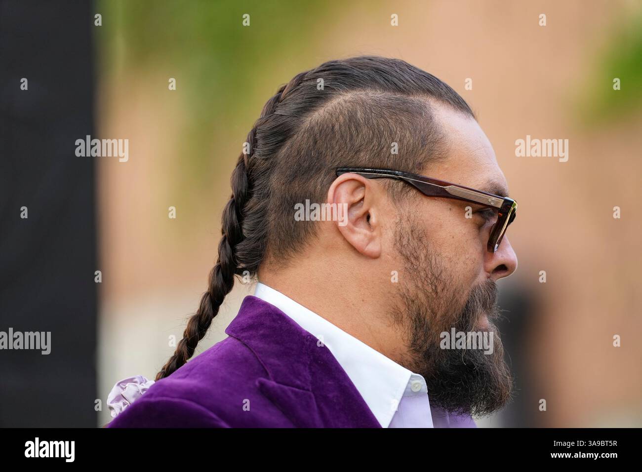 Jason Momoa poses for photographers upon arrival at the World premiere ...