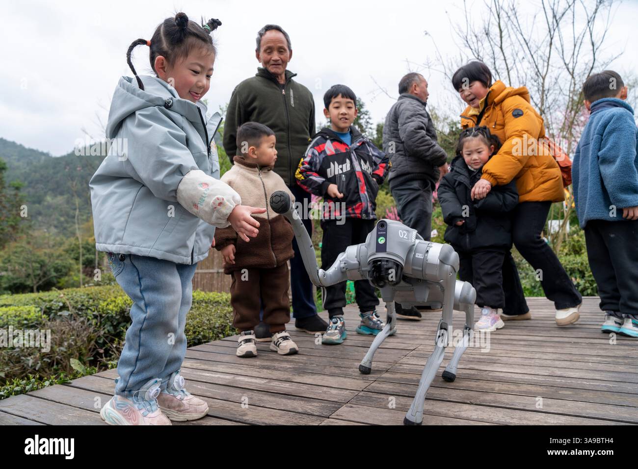 Visitors visit the G02 bionic four-legged transport robot dog at ...