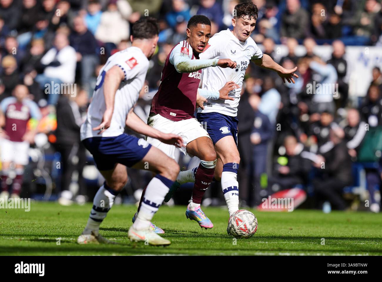 Aston Villa's Jacob Ramsey (centre) breaks past Preston North End's Jordan Storey on their way ...
