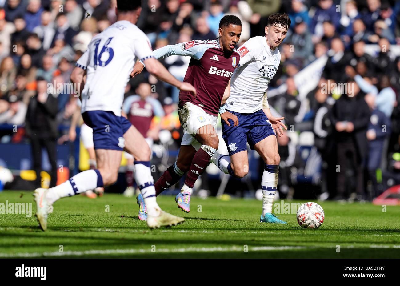 Aston Villa's Jacob Ramsey (centre) breaks past Preston North End's Jordan Storey on their way ...