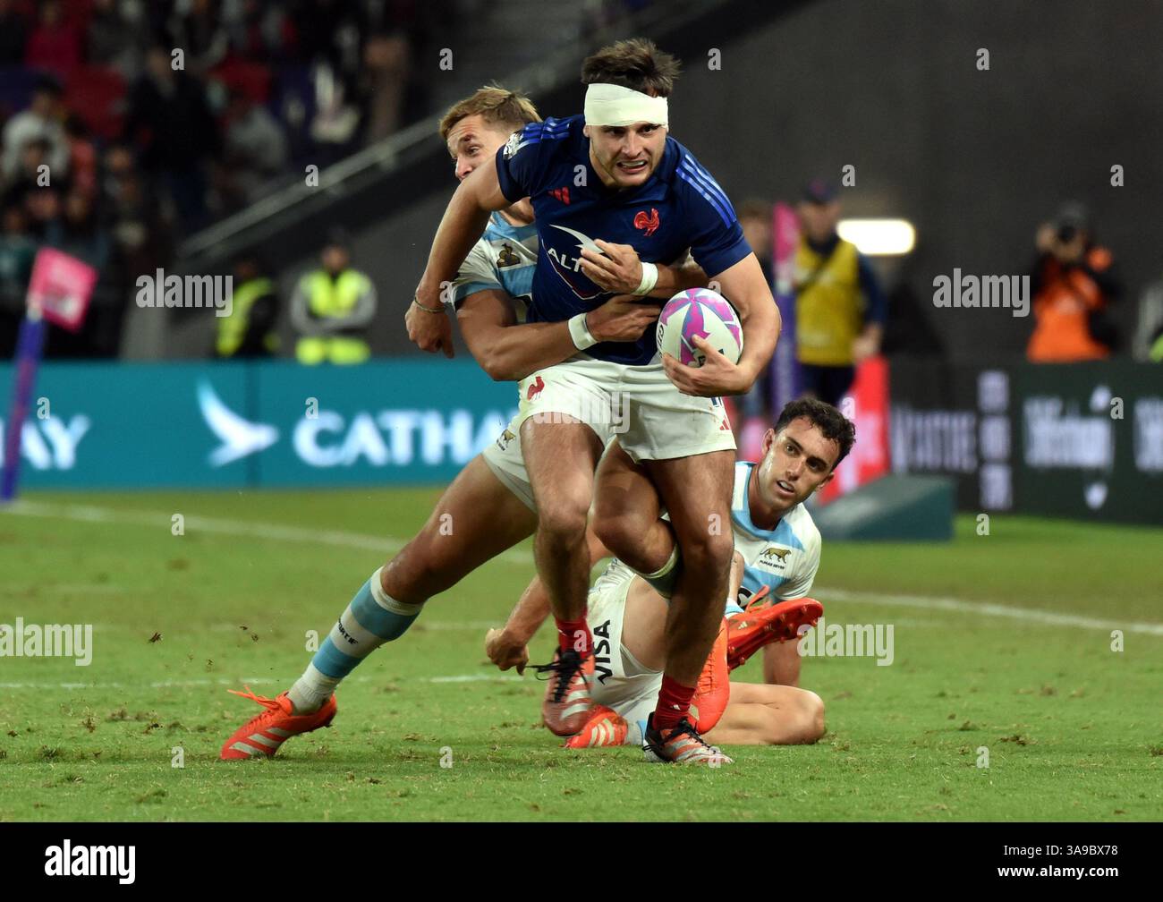 Hong Kong. 30th Mar, 2025. Simon Desert (front) of France vies with ...