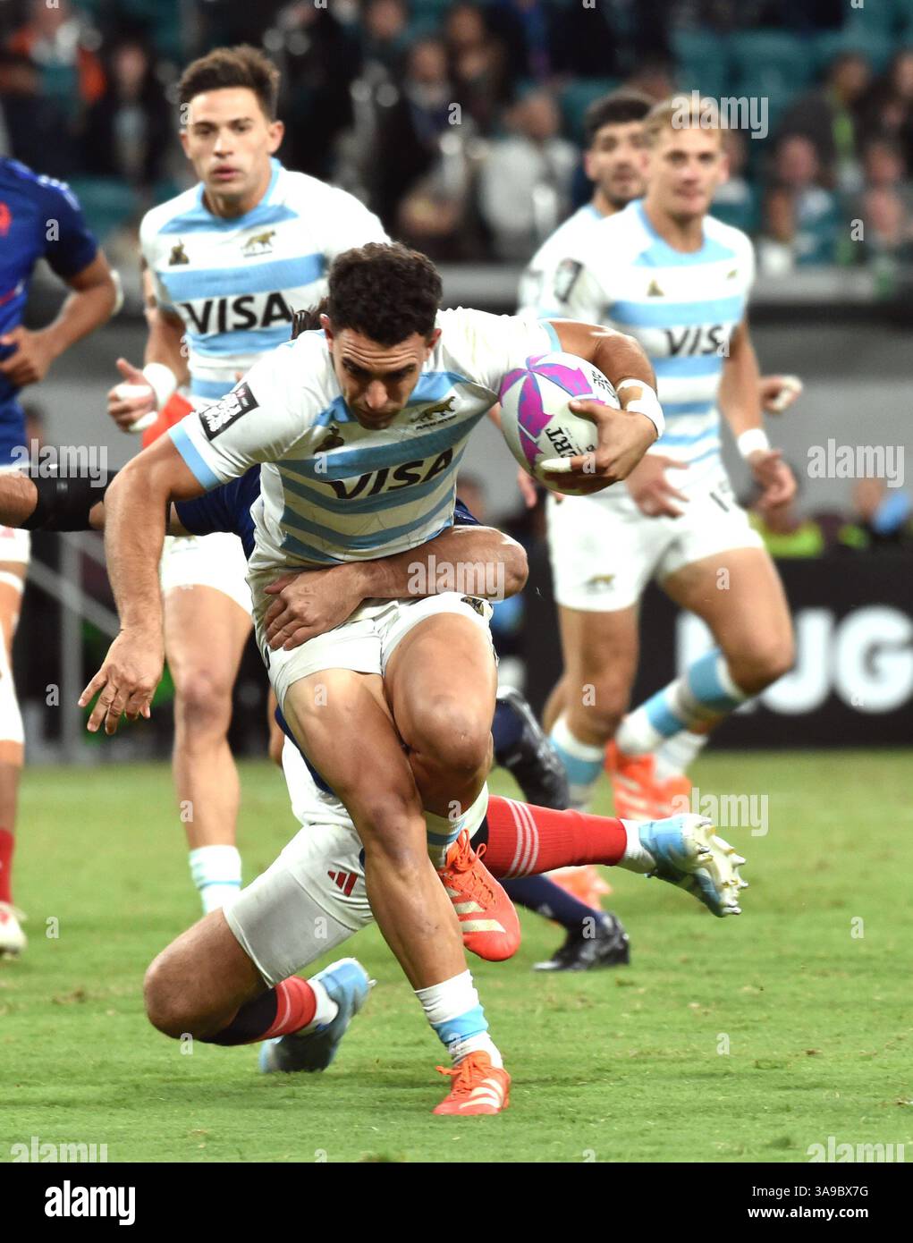 Hong Kong. 30th Mar, 2025. Joaquin Pellandini (front) of Argentina vies ...