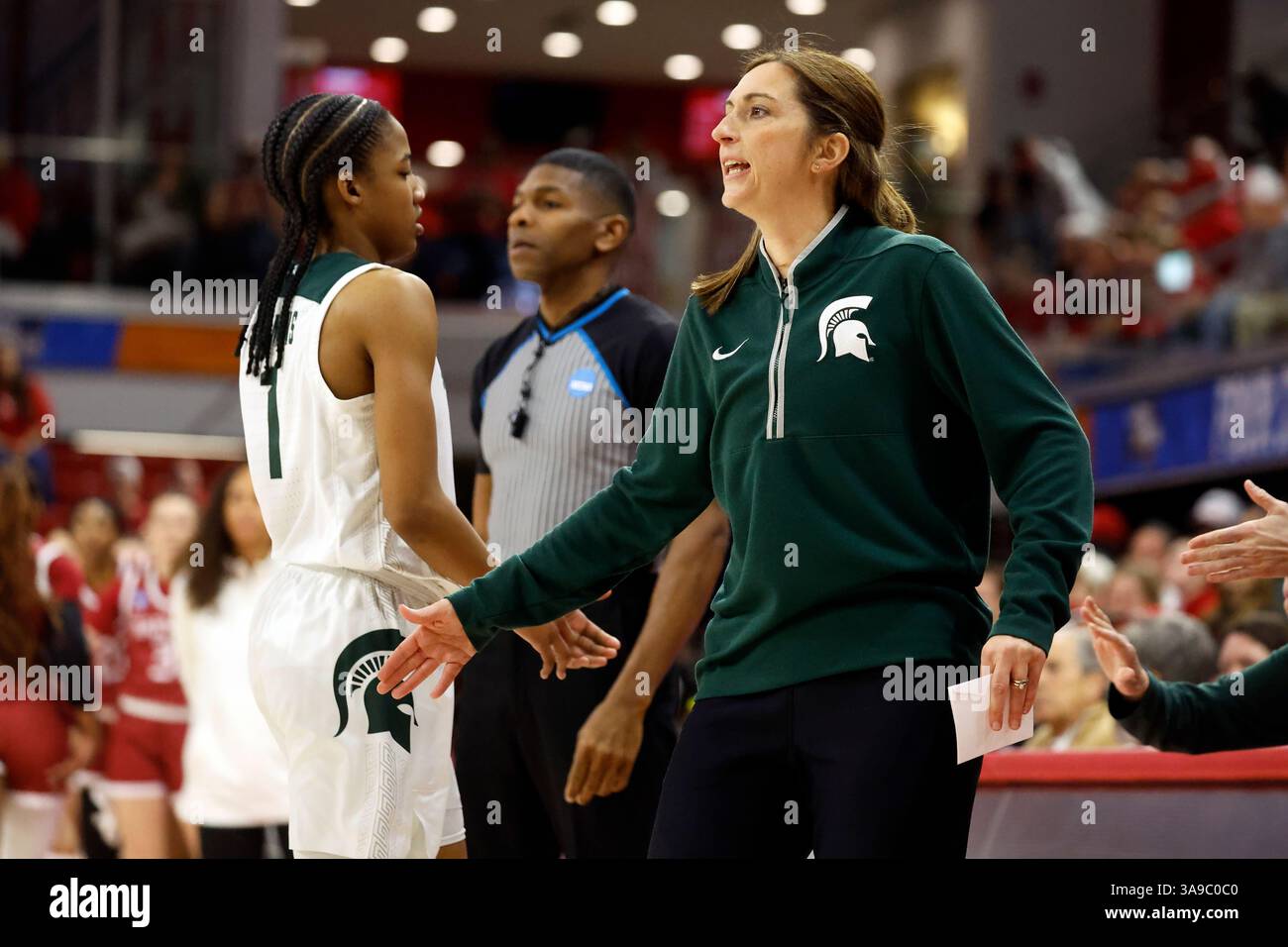 Michigan State head coach Robyn Fralick watches from the sideline ...