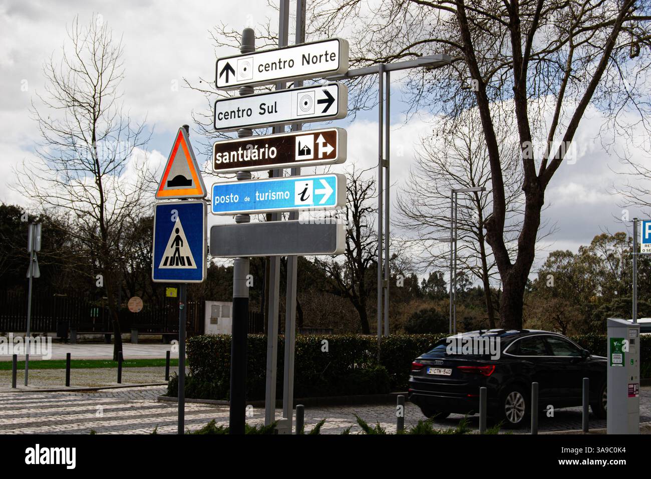 Fatima, Portugal - March 24, 2025: Directional road signs and parked ...