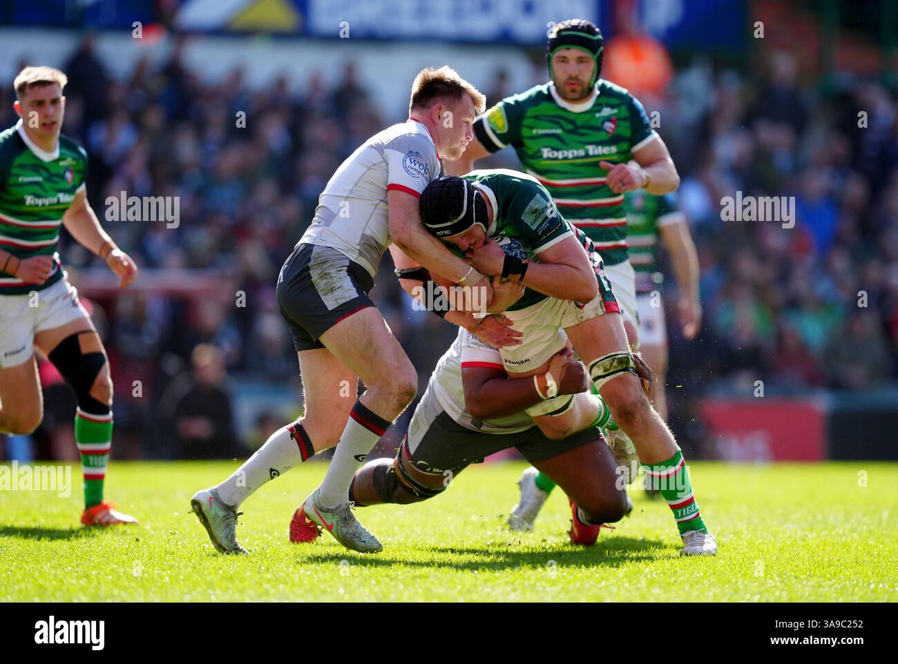 Leicester Tigers' Cameron Henderson is tackled by Saracens' Nick ...