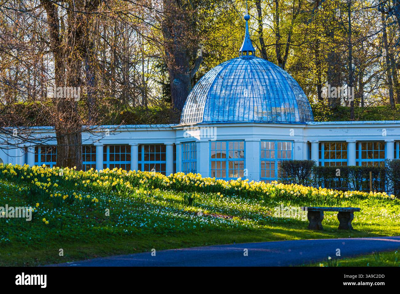 Colorful spring flowers bloom in front of a charming historic building ...