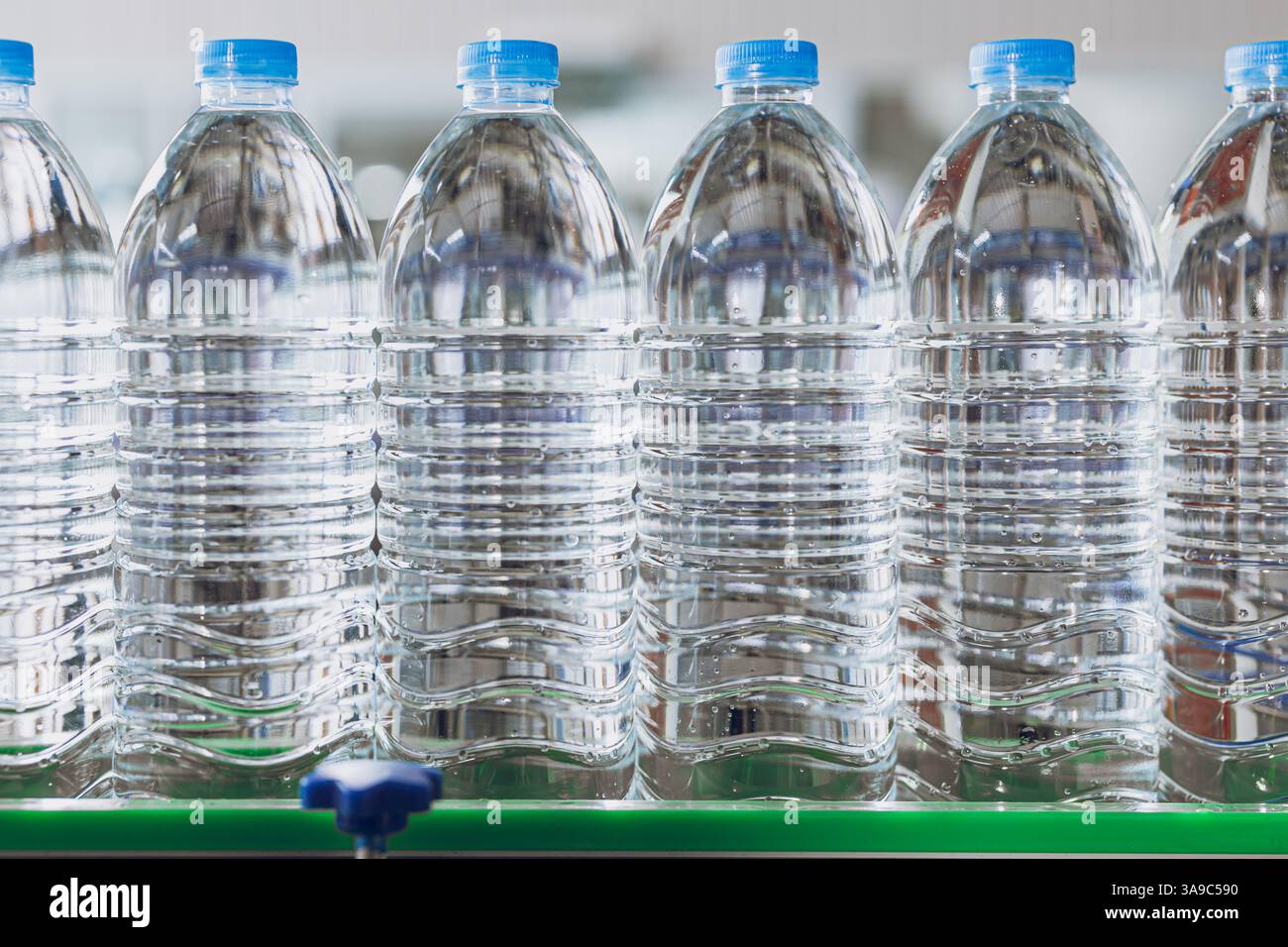 Drinking water production line on conveyor belt. PET Plastic water ...