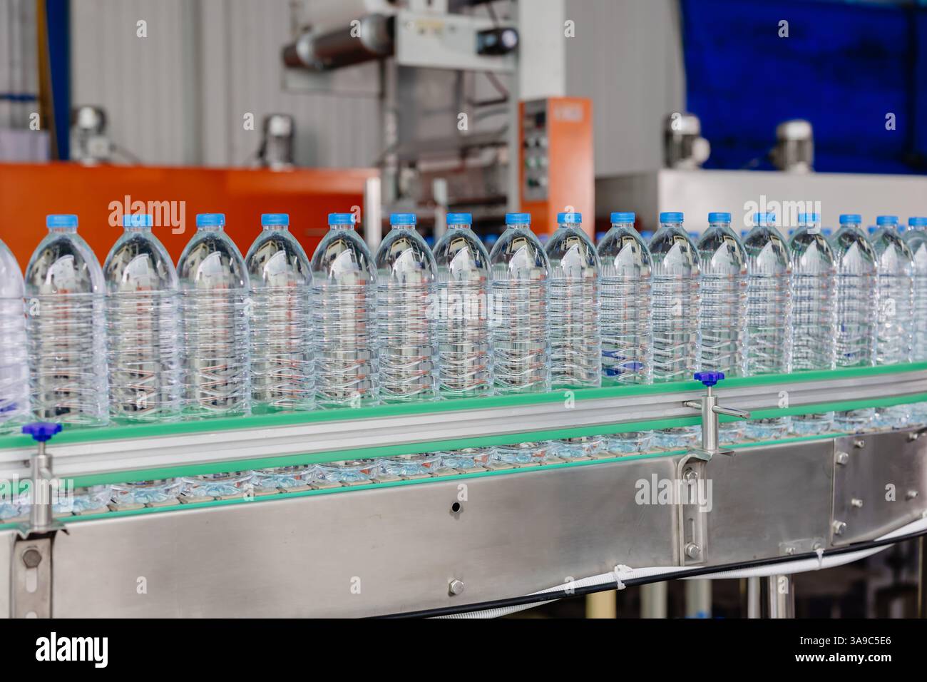 Drinking water production line on conveyor belt. PET Plastic water ...