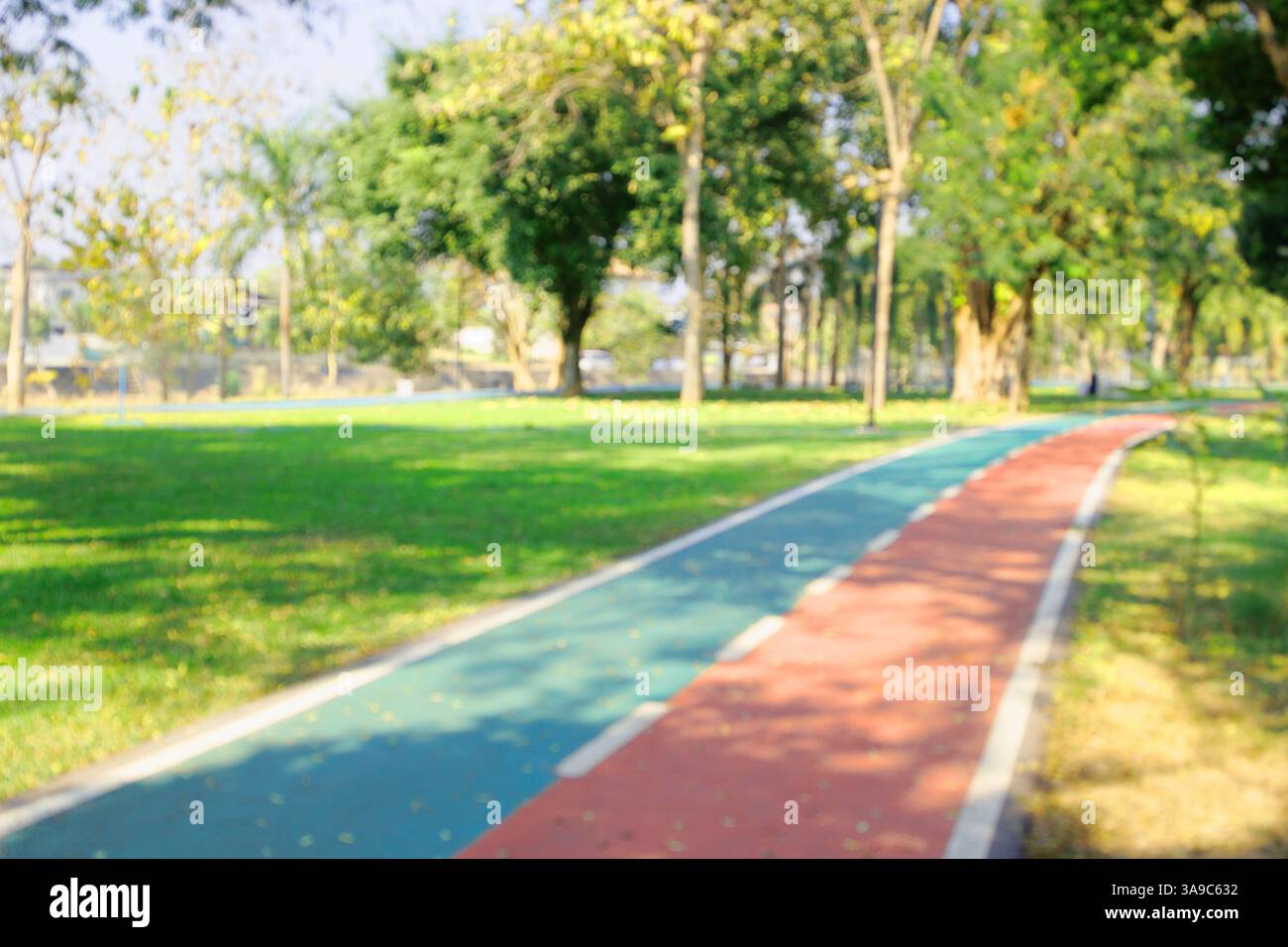 blur view of running walking track at city public park outdoor with ...