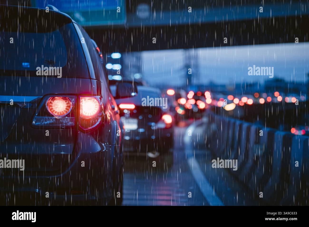 Traffic jam in evening with storm raining. people stuck on heavy ...
