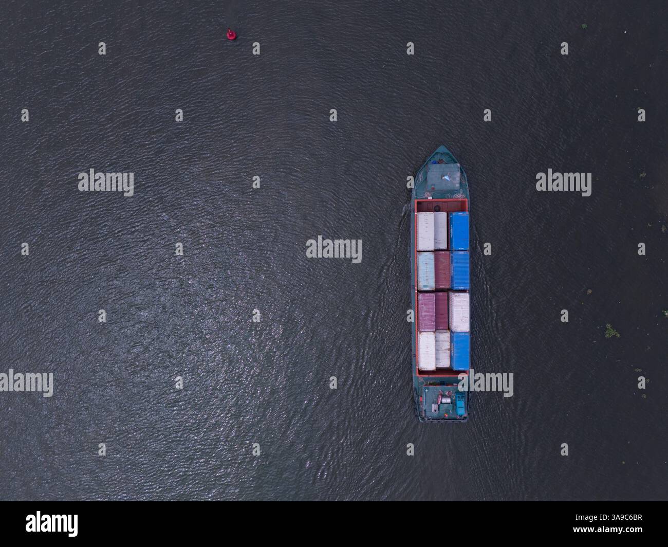 Large ship is floating in the water. The ship is blue and red Stock ...