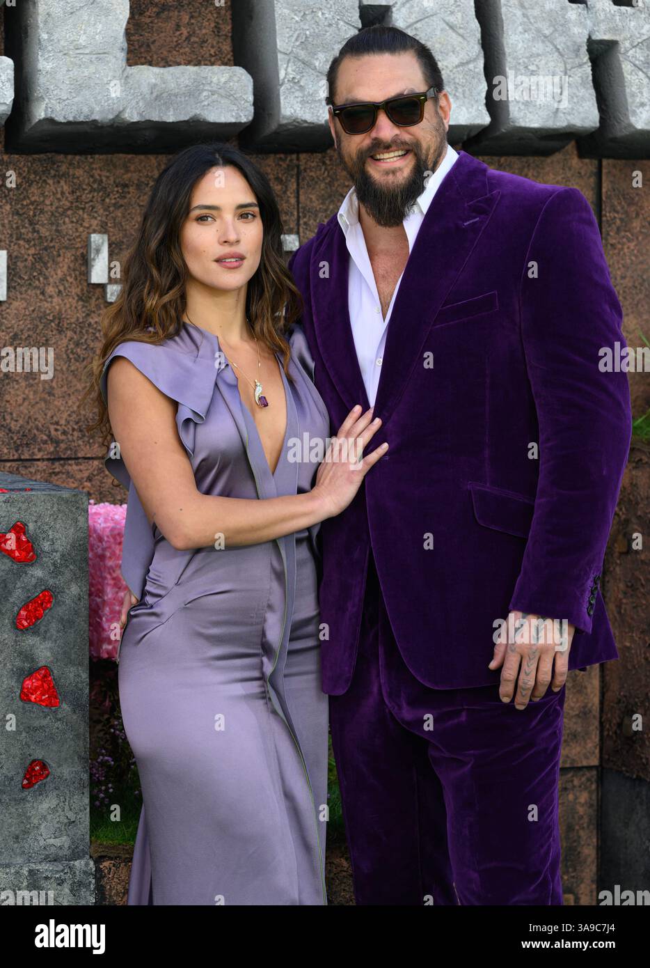 London, UK. March 30th, 2025. Adria Arjona and Jason Momoa arriving at ...