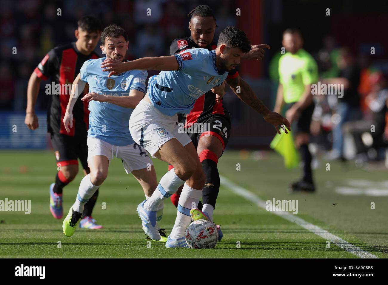 Manchester City's Matheus Nunes, front, duels for the ball with ...