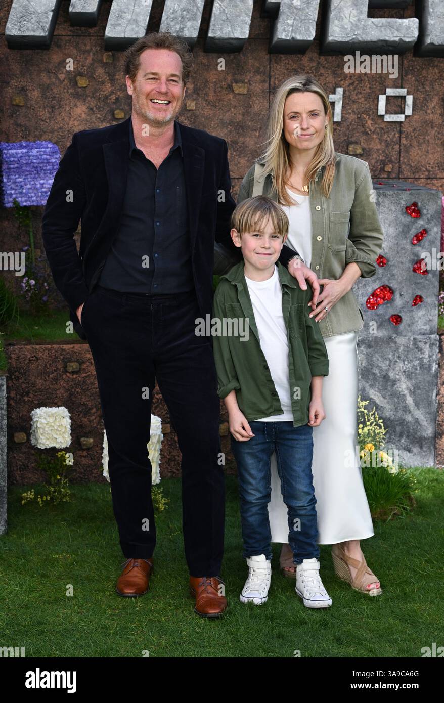 London, UK. March 30th, 2025. Victoria Shalet and Adam James arriving at A Minecraft Movie World ...