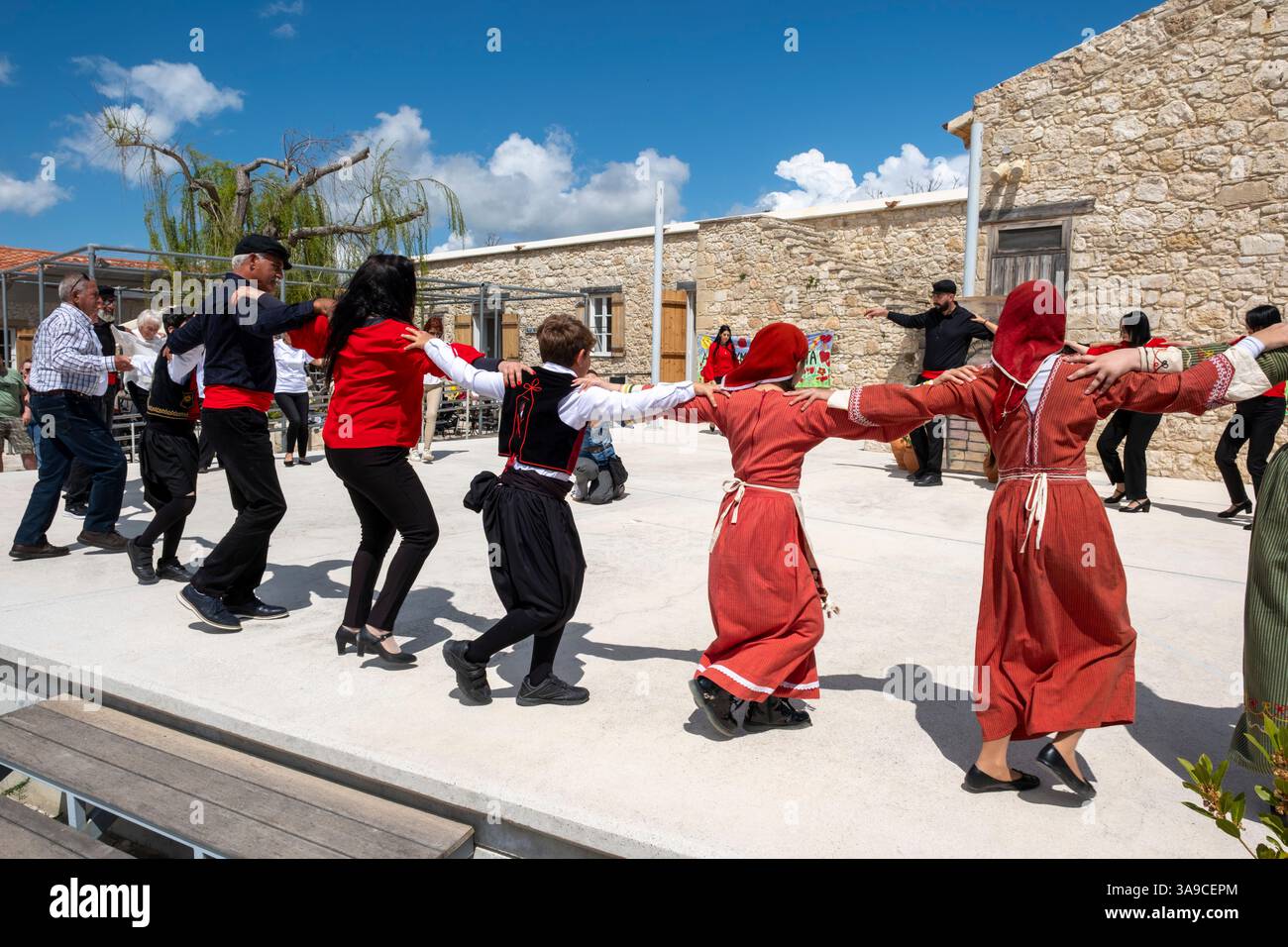 Folk dancers in traditional dress performing at the Polemi Tulip ...