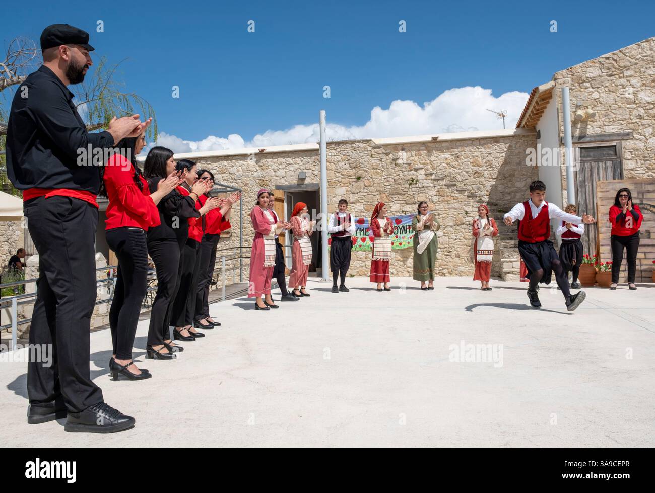 Folk dancers in traditional dress performing at the Polemi Tulip ...