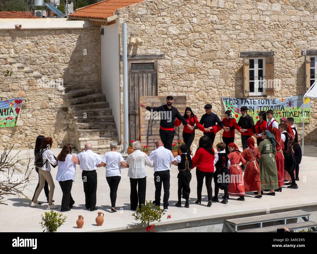 Folk dancers in traditional dress performing at the Polemi Tulip ...