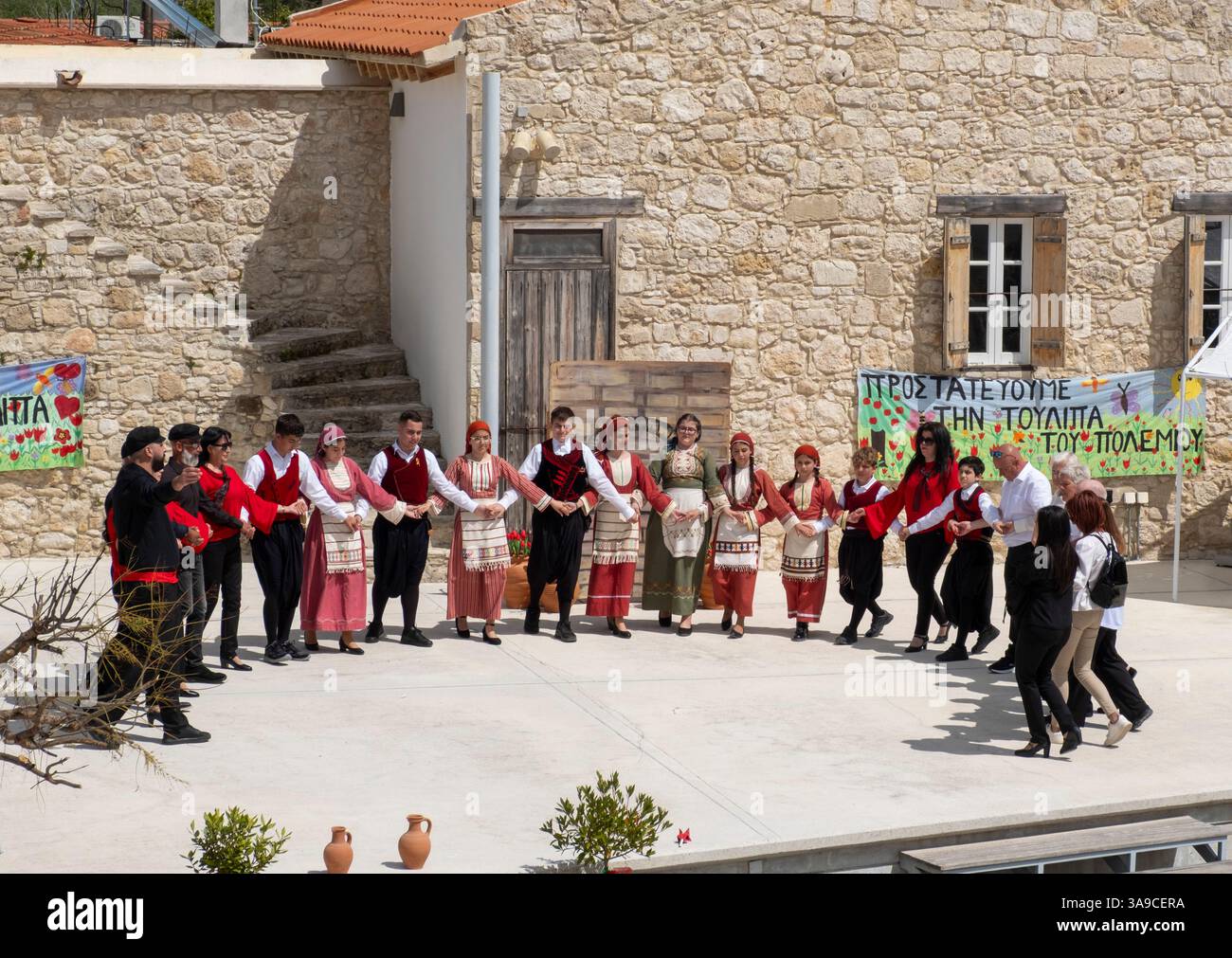 Folk dancers in traditional dress performing at the Polemi Tulip ...