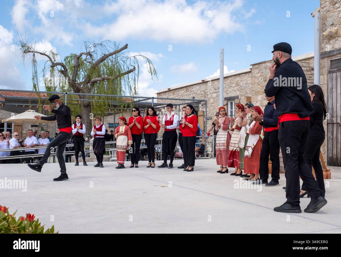 Folk dancers in traditional dress performing at the Polemi Tulip ...