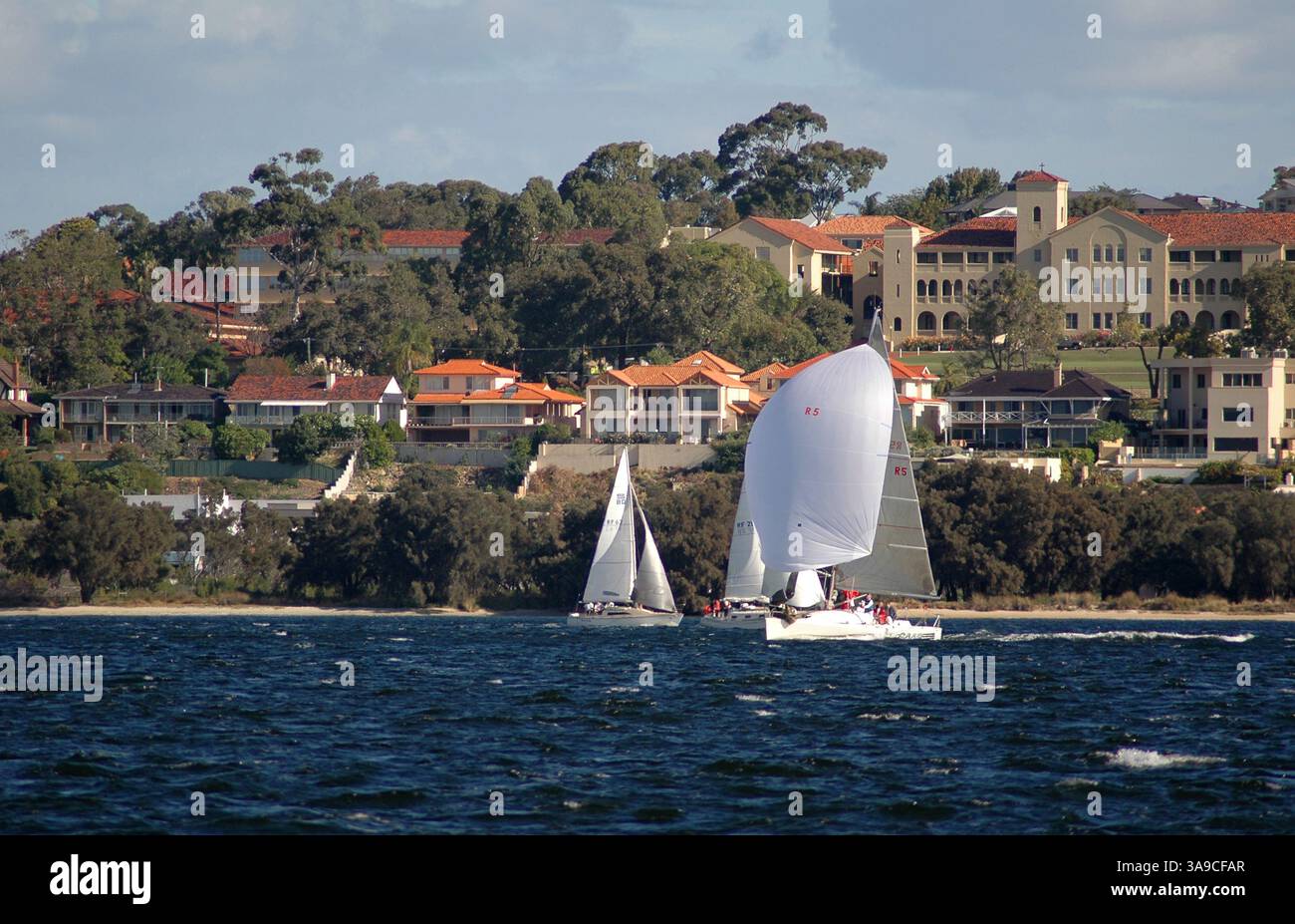 Dinghy and yacht sailing on the Swan River, Perth, Western Australia ...