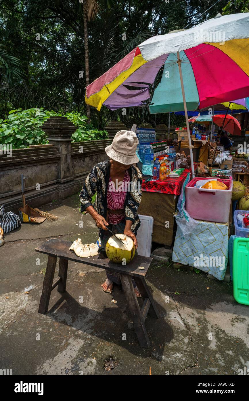 Bali, Indonesia - November 11, 2024: Local Balinese vendor in bucket ...