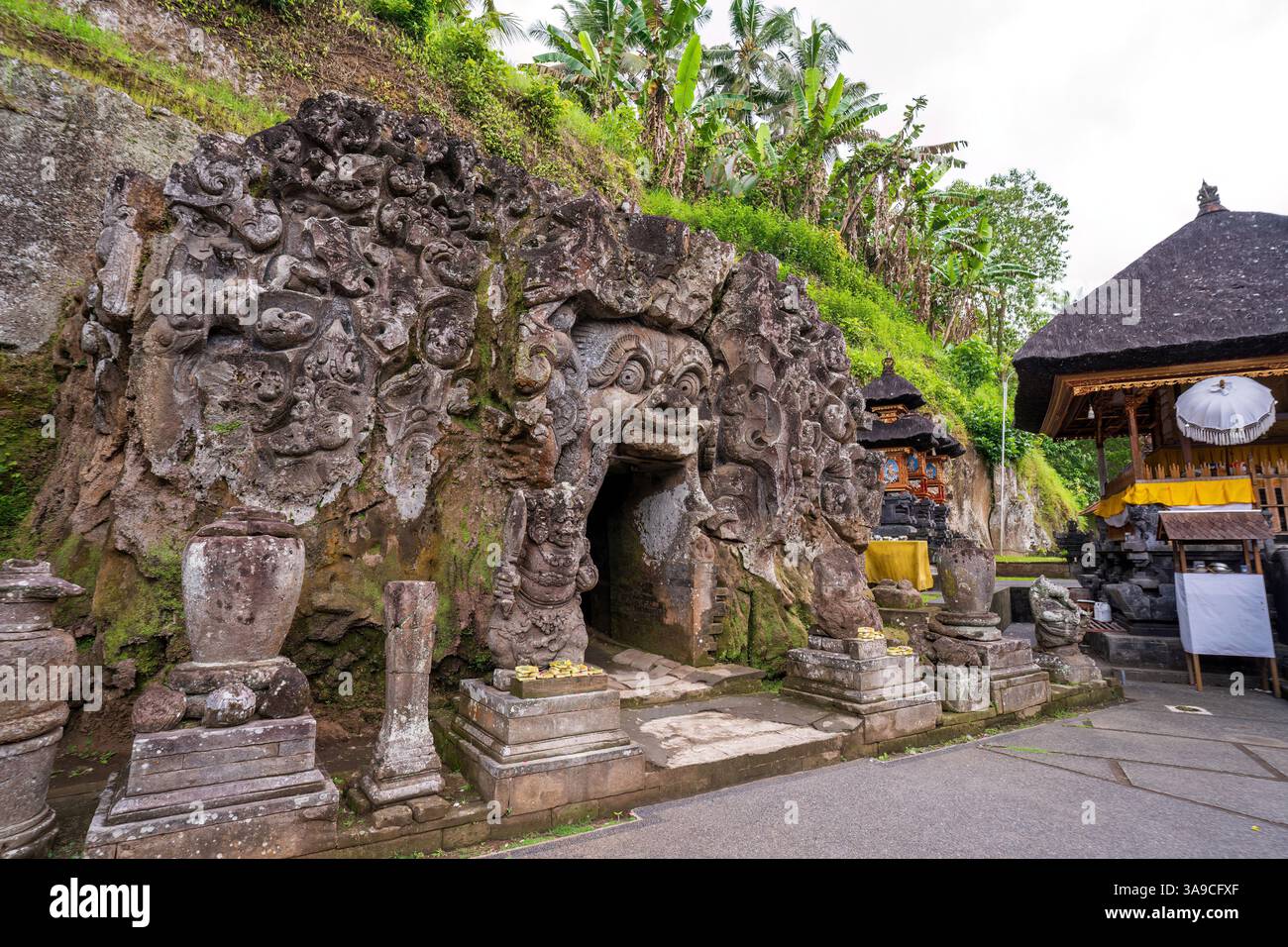 The Goa Gajah cave in Bali features intricate stone carvings and a ...