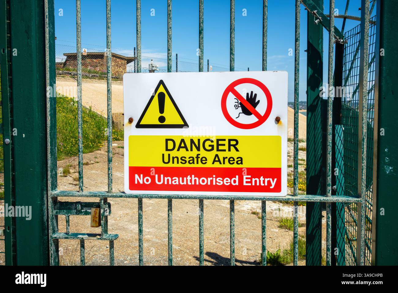 Danger unsafe area No unauthorized entry Sign on gated fence Hythe ...