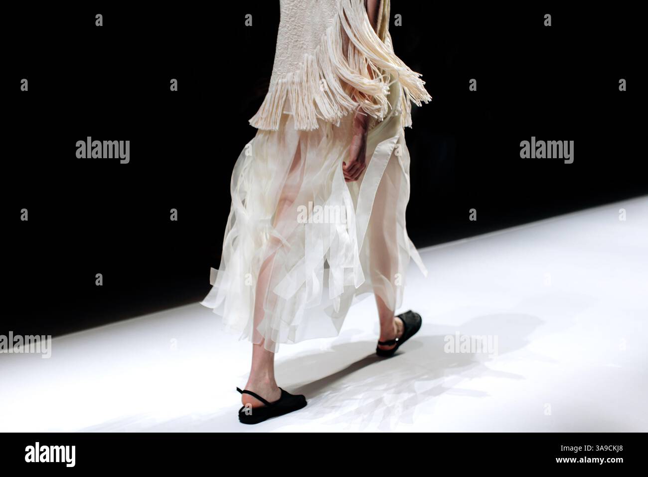 Fancy outfit of white transparent skirt and flat black shoes, fashion ...