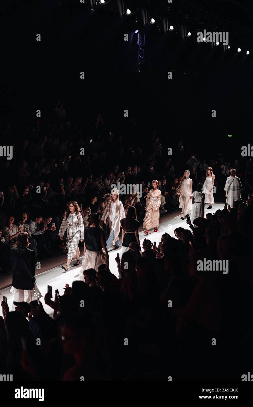 Fashion models in stylish outfits line up at the finale of a fashion ...