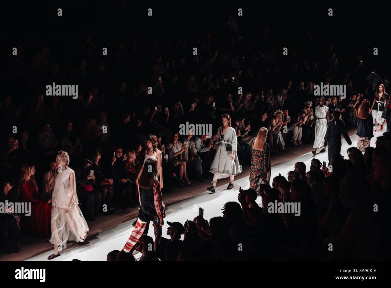 Fashion models in stylish outfits line up at the finale of a fashion ...