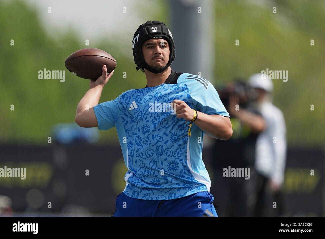 Raw Miami quarterback Helaman Casuga throws a pass during an OT7 ...