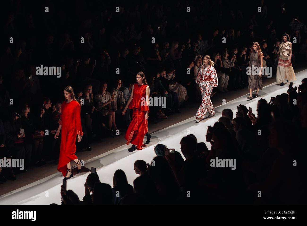 Fashion models in stylish outfits line up at the finale of a fashion ...