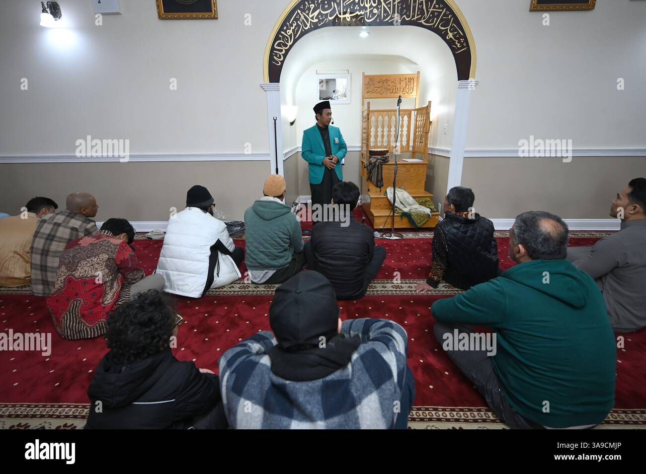 New York, USA. 30th Mar, 2025. Imam Mohamed Yosef leads embers of the ...