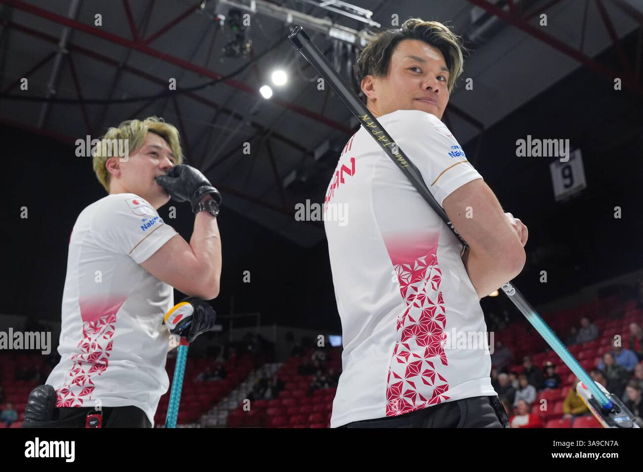 Japan's skip Tsuyoshi Yamaguchi (right) and lead Satoshi Koizumi look ...