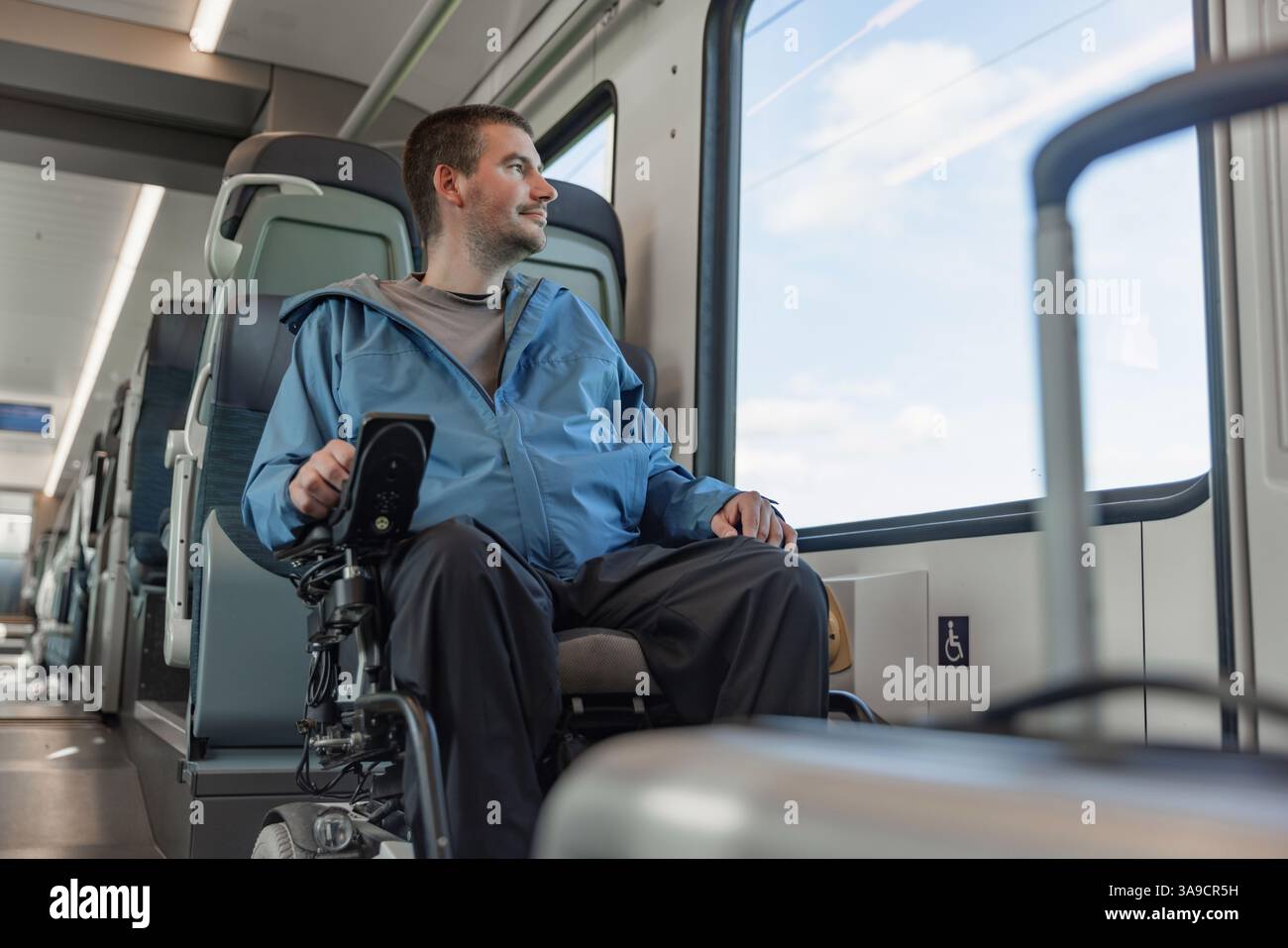 Person in wheelchair moving through hi-res stock photography and images ...